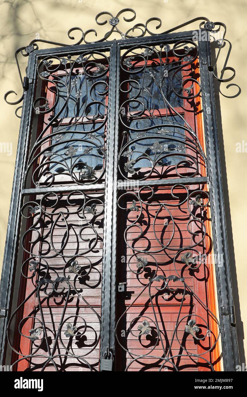 Wrought iron protector on a window of a house Stock Photo - Alamy