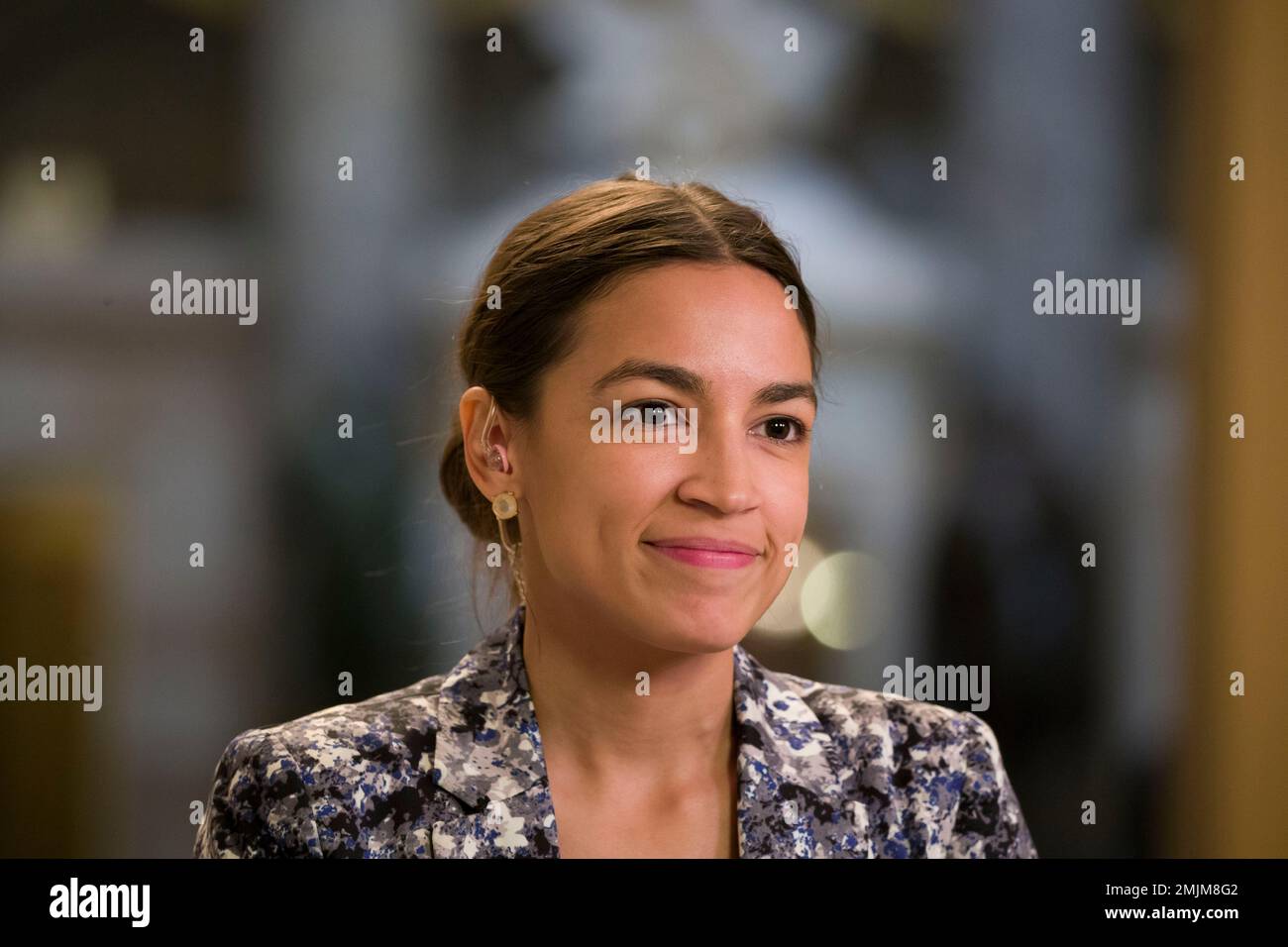 Rep. Alexandria Ocasio-Cortez, D-N.Y., prepares to do a television ...
