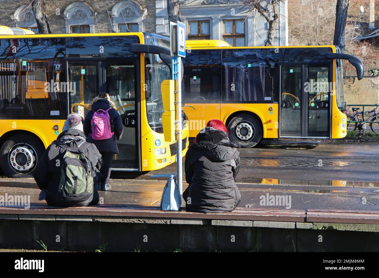 People are waiting at the bus terminal Stock Photo - Alamy