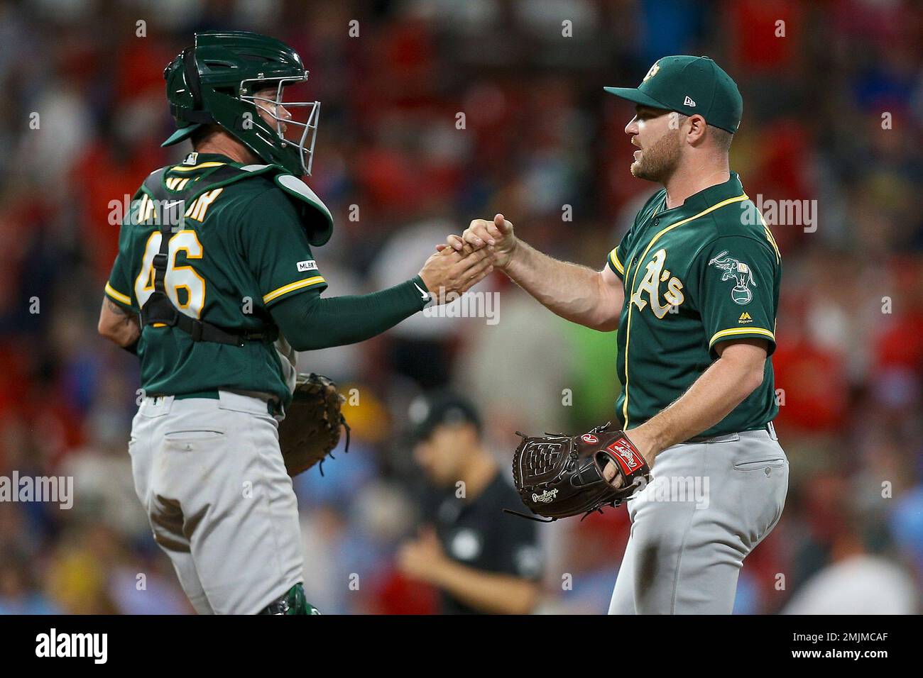 Oakland Athletics catcher Beau Taylor (46) and relief pitcher Liam ...