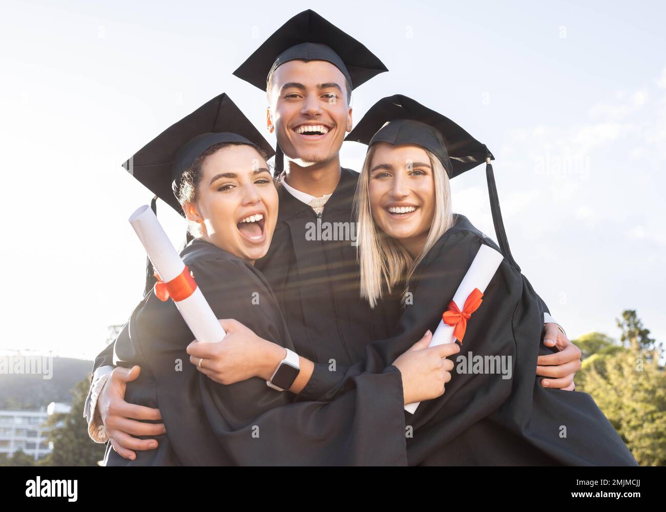 Student graduation, group portrait and hug for celebration, success and ...