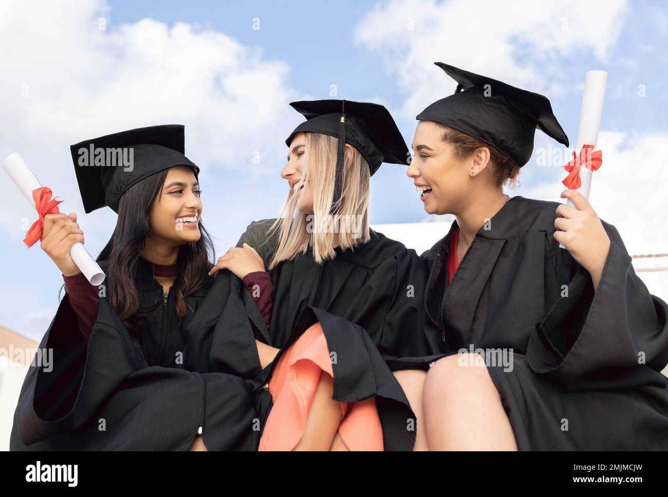 Graduation, education and group of friends celebrate success on sky ...
