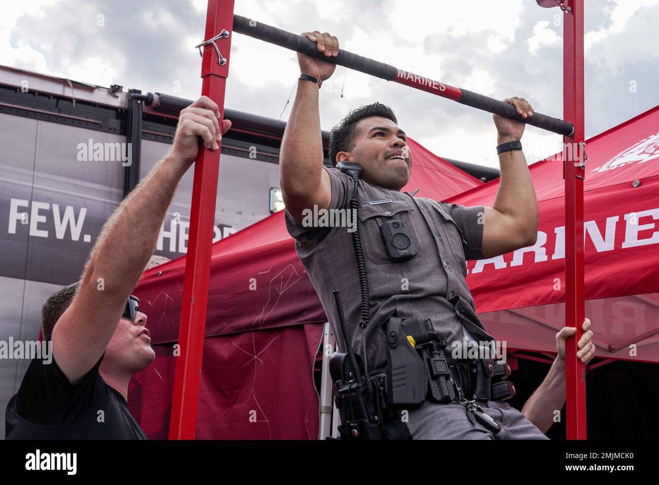 U.S. Marine Corps Staff Sgt. Brandon Ashby, left, a recruiter with ...