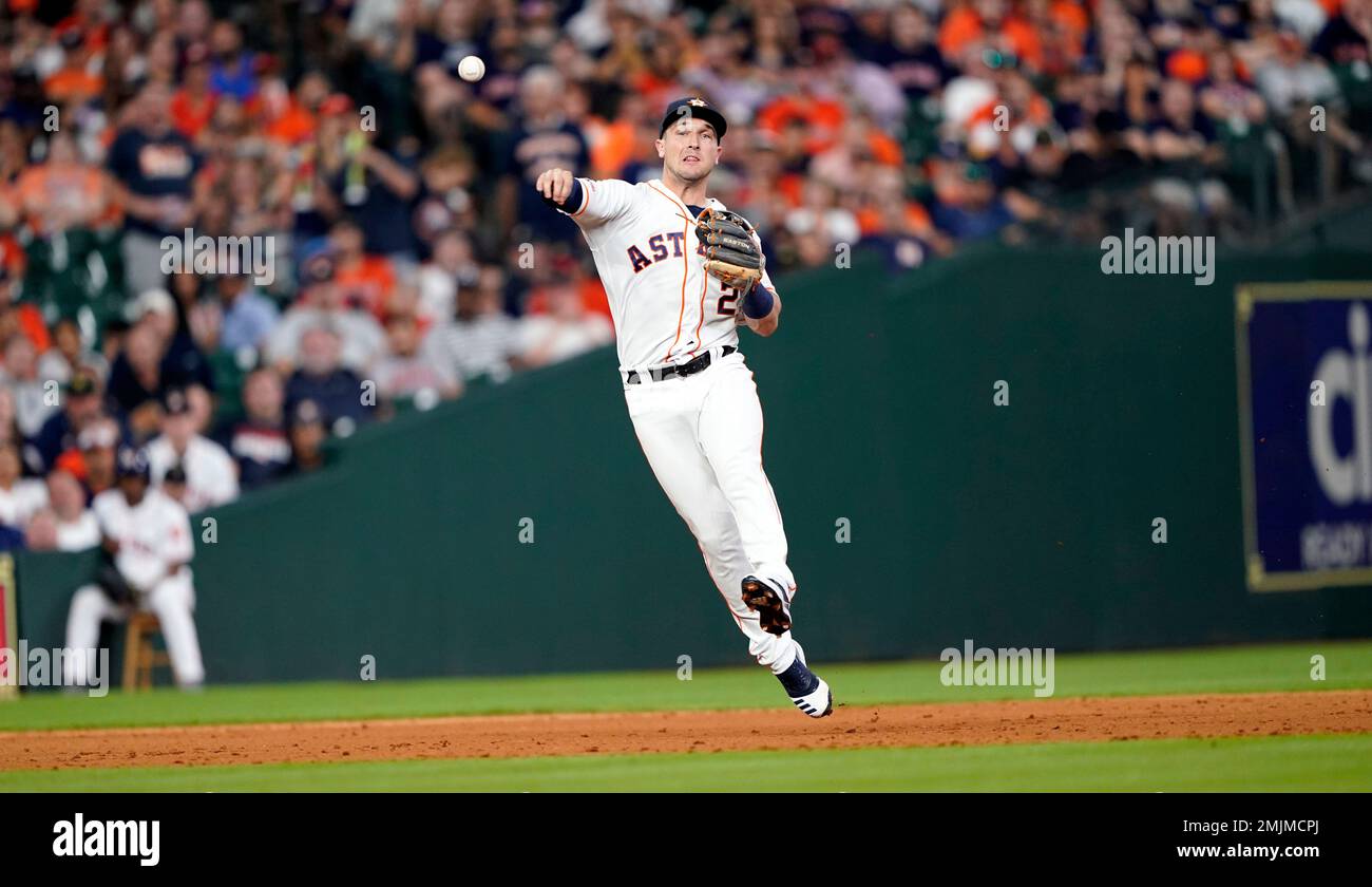 Houston Astros shortstop Alex Bregman throws to first for the out after ...