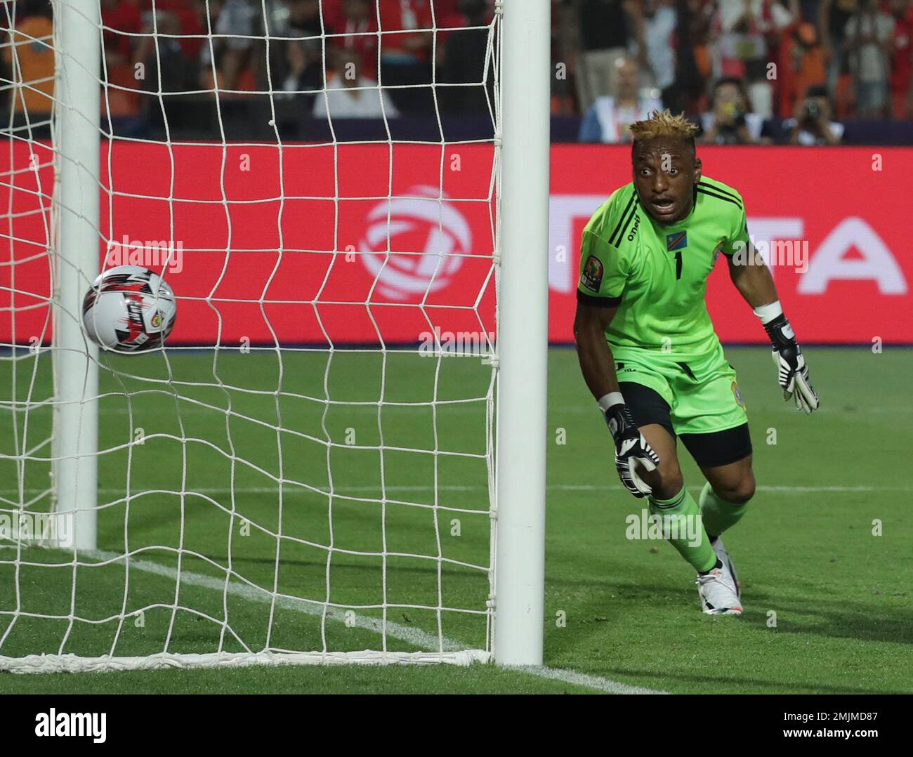 DR Congo's goalkeeper Matampi Ngumbi Ley watches the ball go into the ...