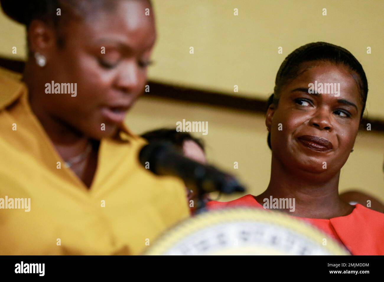 Cook County State's Attorney Kim Foxx, right, listens as Executive ...