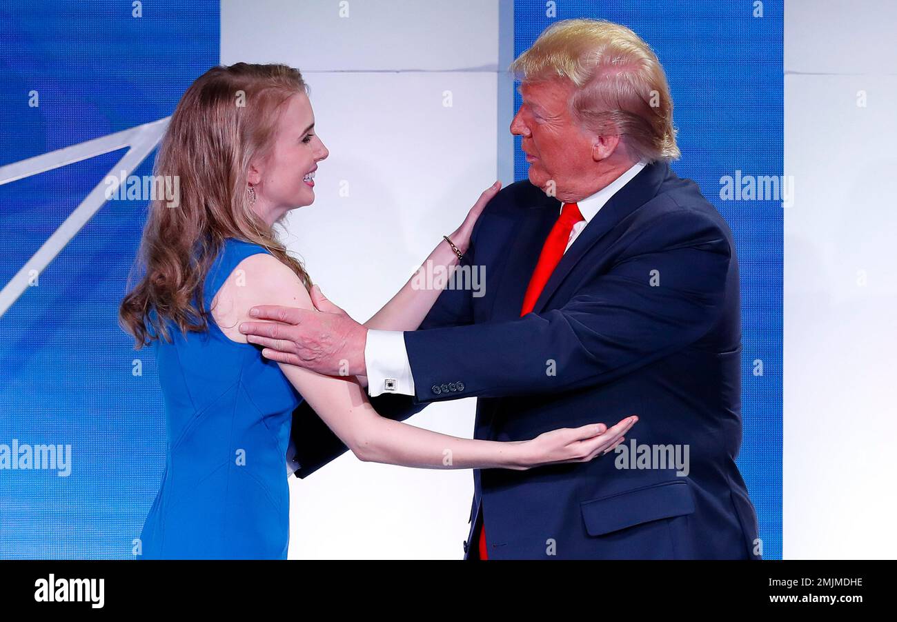 President Donald Trump, right, greets Natalie Harp, left, and invites ...