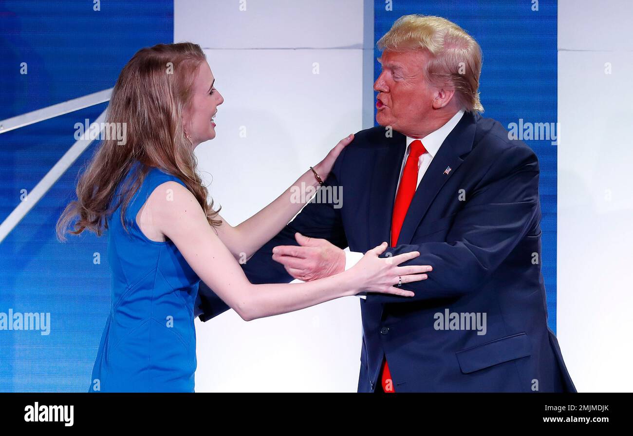 President Donald Trump, right, greets Natalie Harp, left, and invites ...