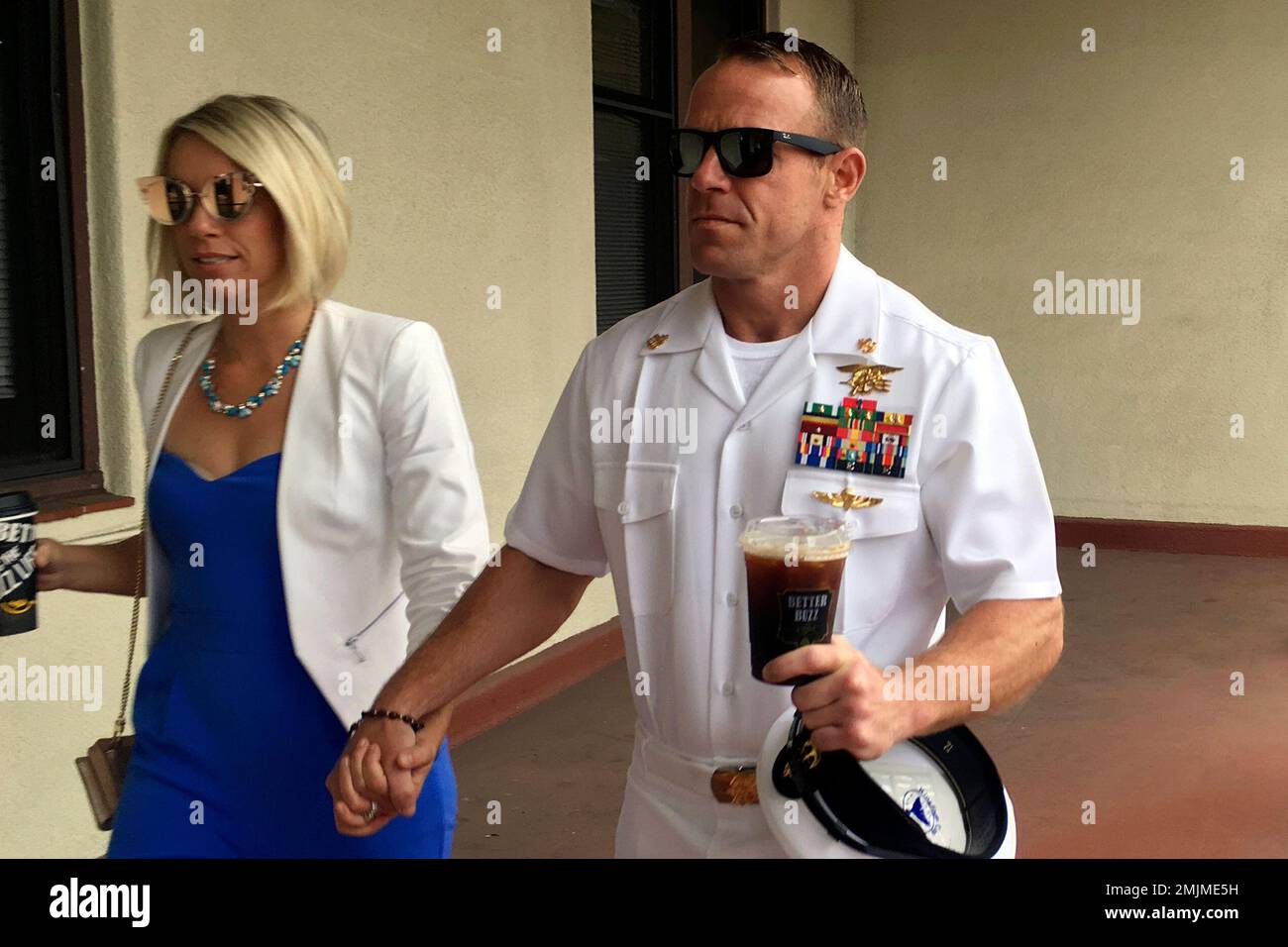 Navy Special Operations Chief Edward Gallagher, right, walks with his ...