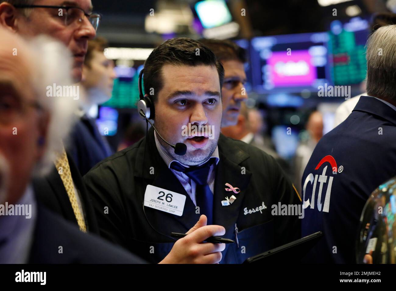FILE - In this June 20, 2019, file photo trader Joseph Lawler works on ...