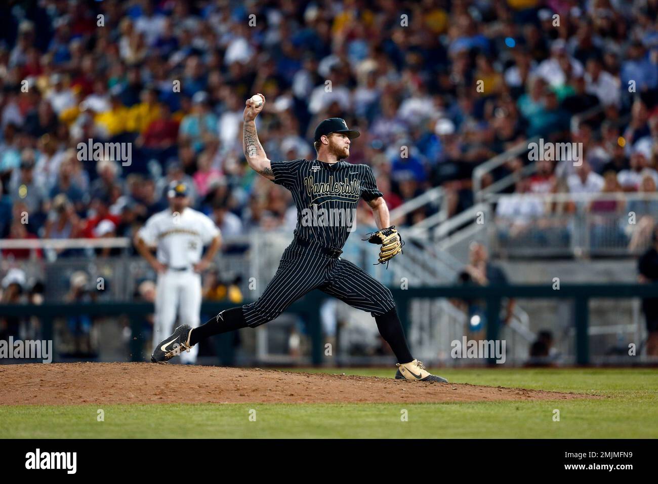 Vanderbilt pitcher Tyler Brown throws against Michigan in the seventh ...