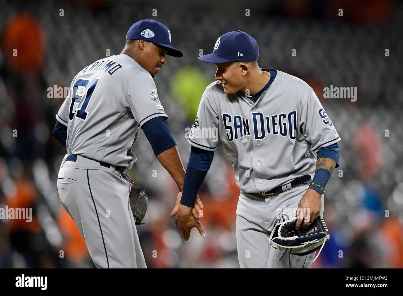 San Diego Padres' Manny Machado, right, celebrates with Luis Perdomo ...