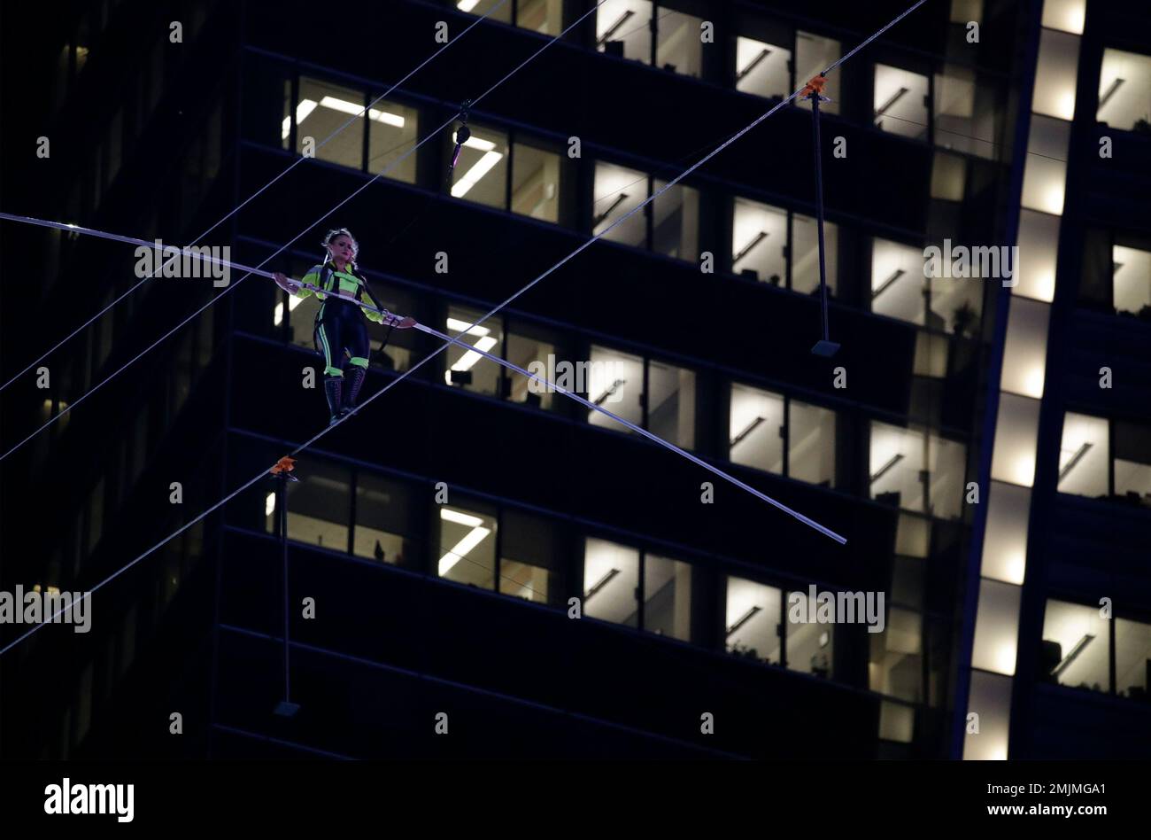 Aerialists Lijana Wallenda walks on a high wire above Times Square ...