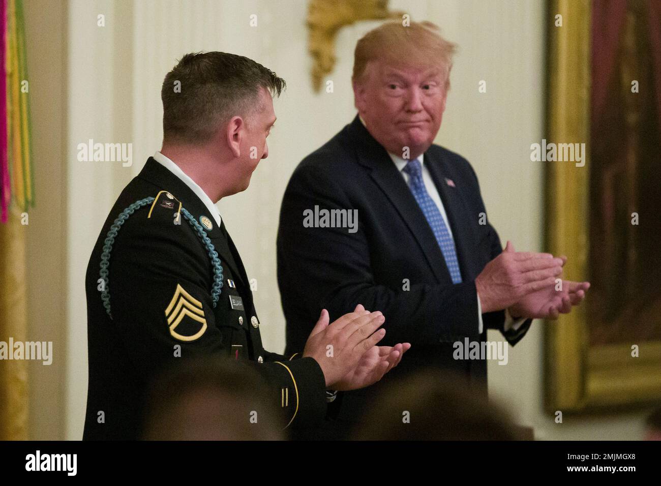 President Donald Trump applauds before awarding the Medal of Honor to ...
