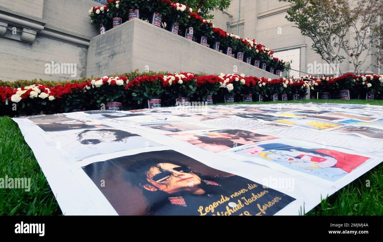 Artwork and flowers line the outside of Michael Jackson's mausoleum in ...