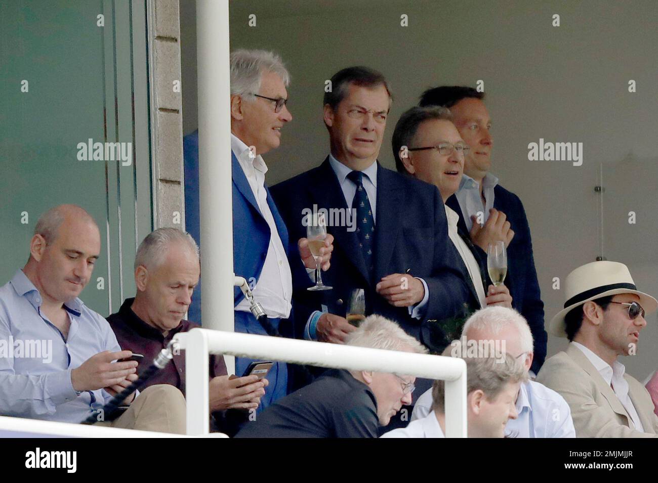 Nigel Farage, third right, the leader of the Brexit Party chats in a ...