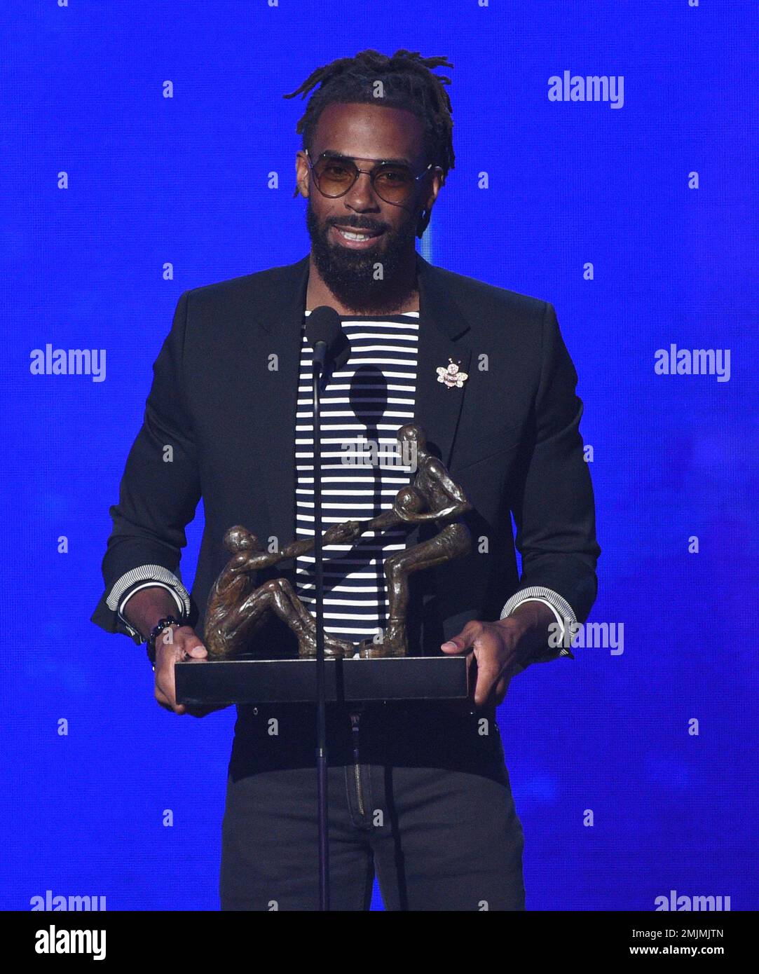 NBA player Mike Conley Jr., of the Memphis Grizzlies, accepts the NBA ...