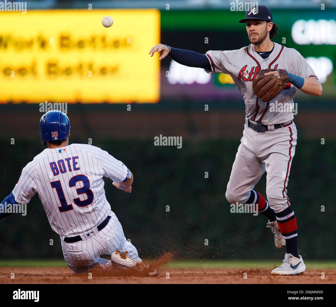 Chicago Cubs' David Bote, left, is out at second base as Atlanta Braves ...