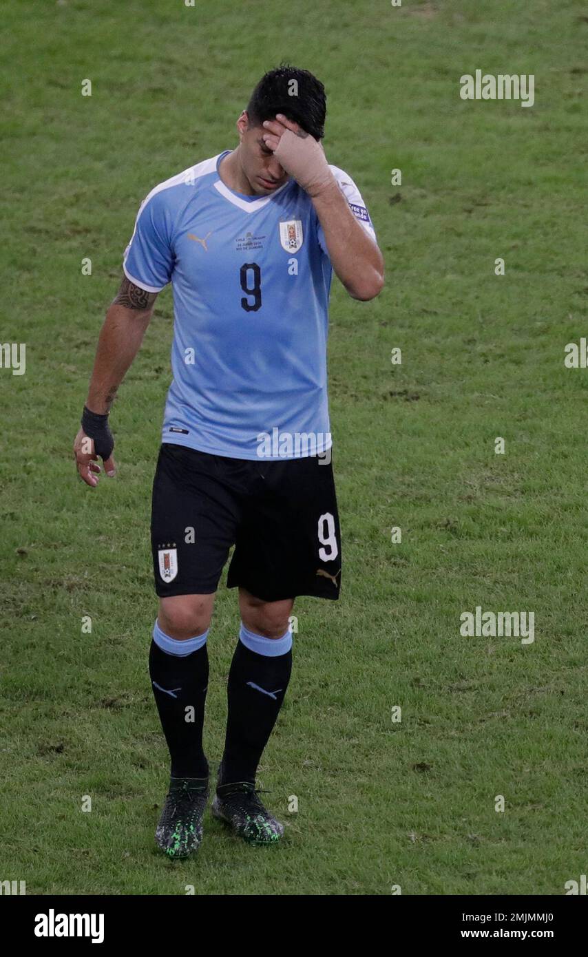 Uruguay's Luis Suarez leaves the pitch at the end of a first half ...