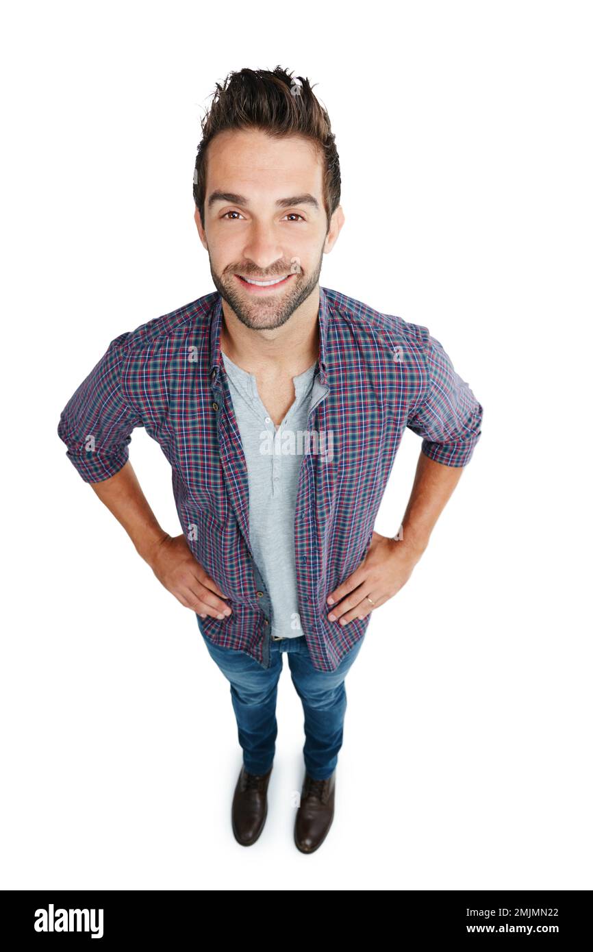 Im standing tall. Studio shot of a young man posing against a white ...