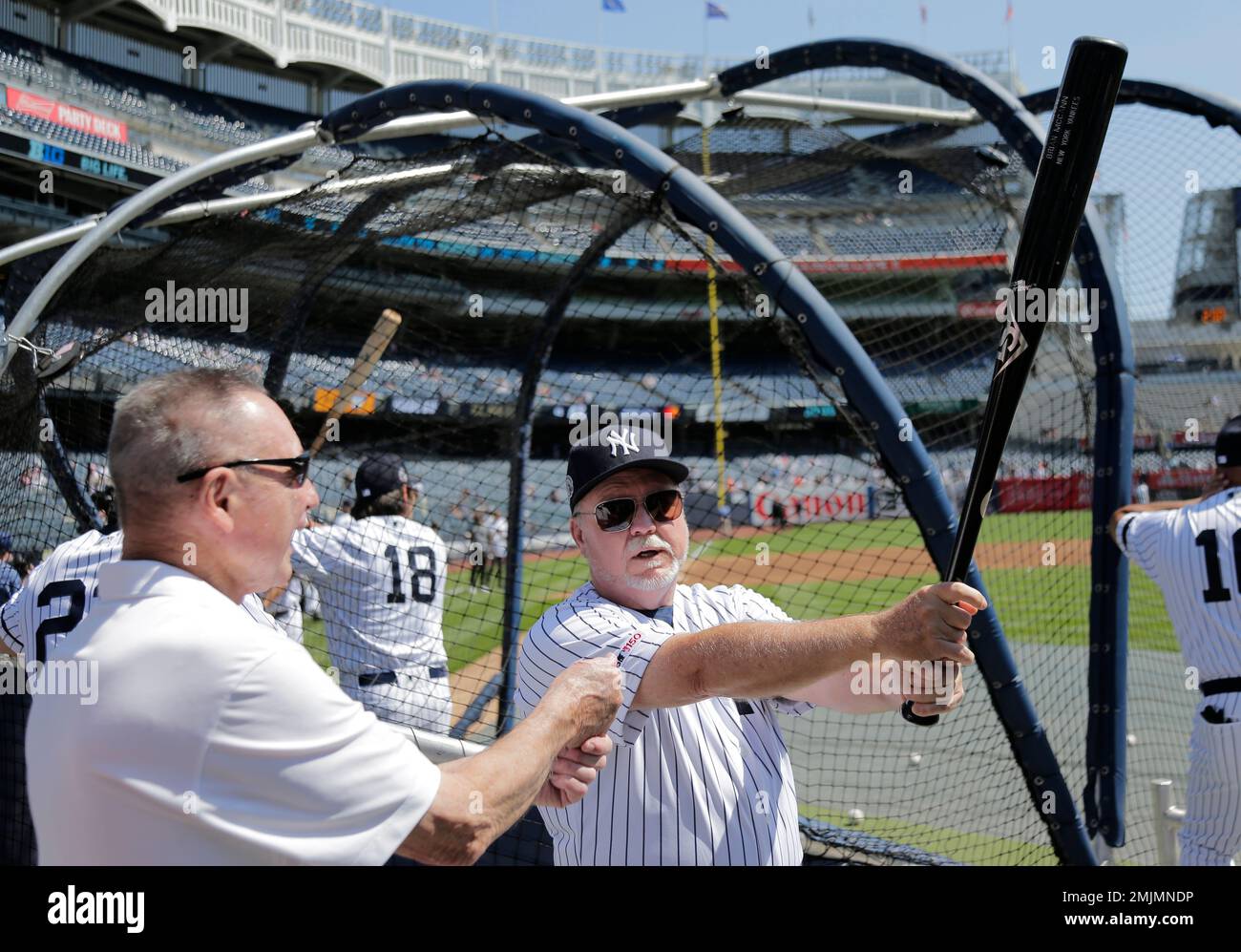 Former New York Yankee Brian Doyle gives some golf tips during Old ...