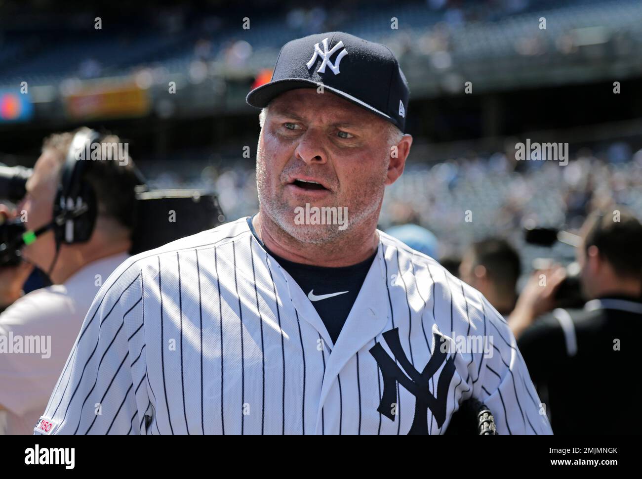 Former New York Yankee Jason Giambi talks to reporters during Old Timer ...