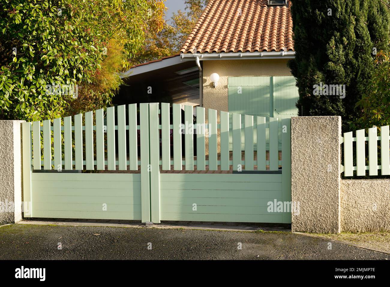 steel large green clear metal gate fence on modern house Stock Photo ...