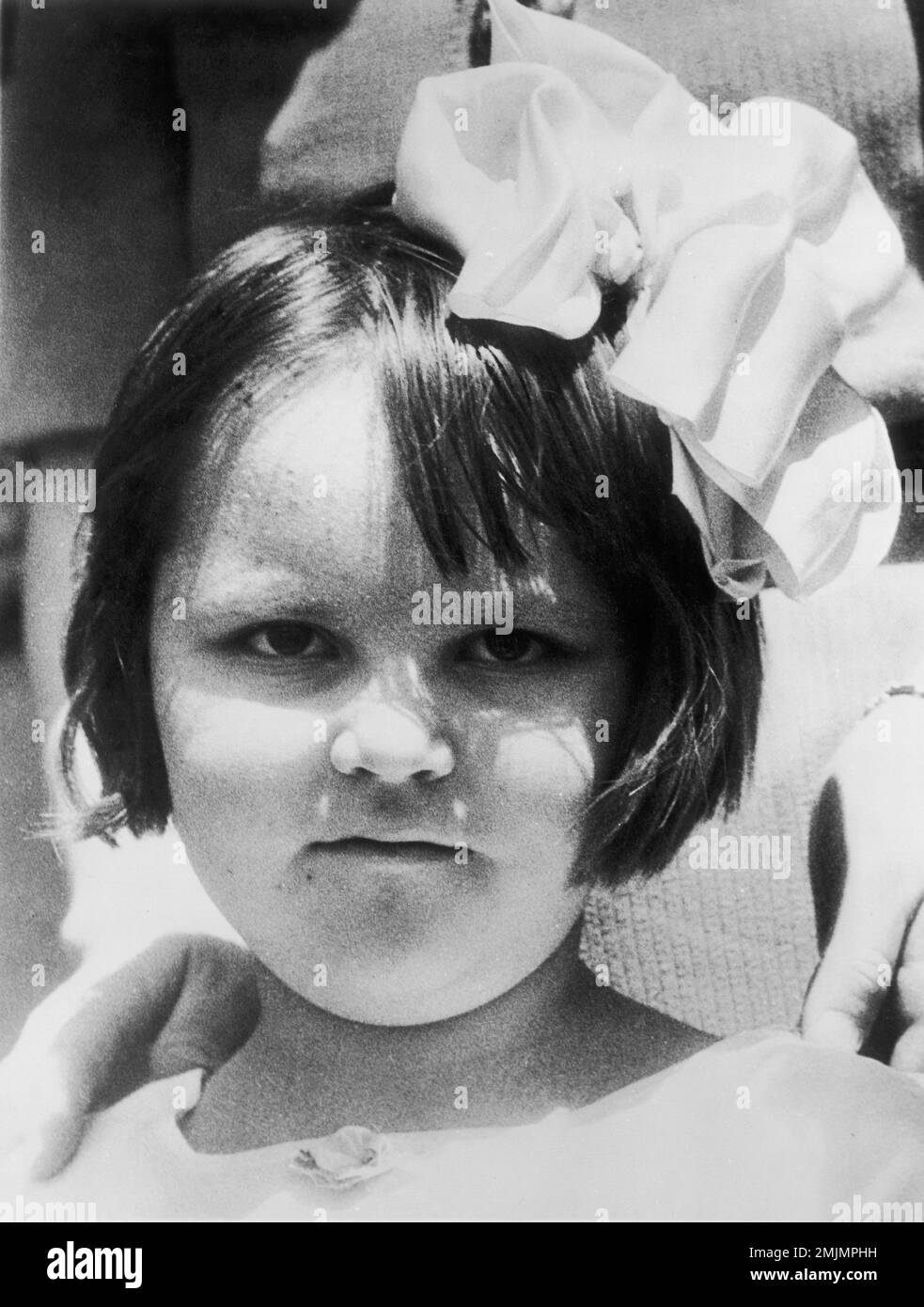 Six-year-old June Robles, daughter of Fernando and Helen Robles, is ...