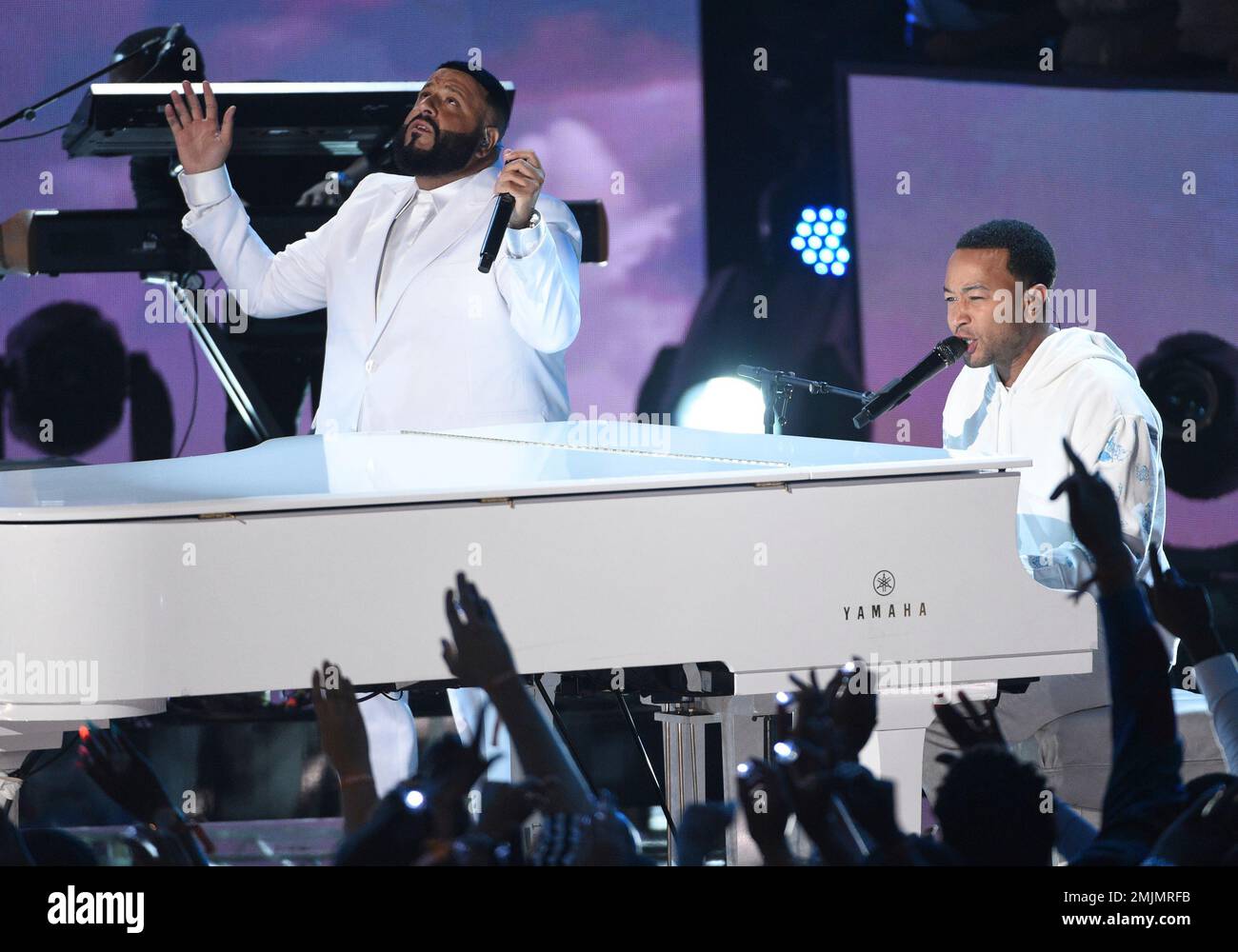 DJ Khaled, left, and John Legend perform during a tribute to late ...