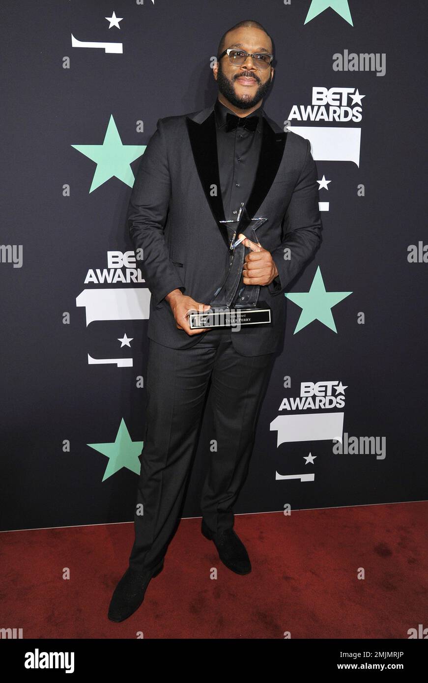 Tyler Perry poses in the press room with the ultimate icon award at the ...