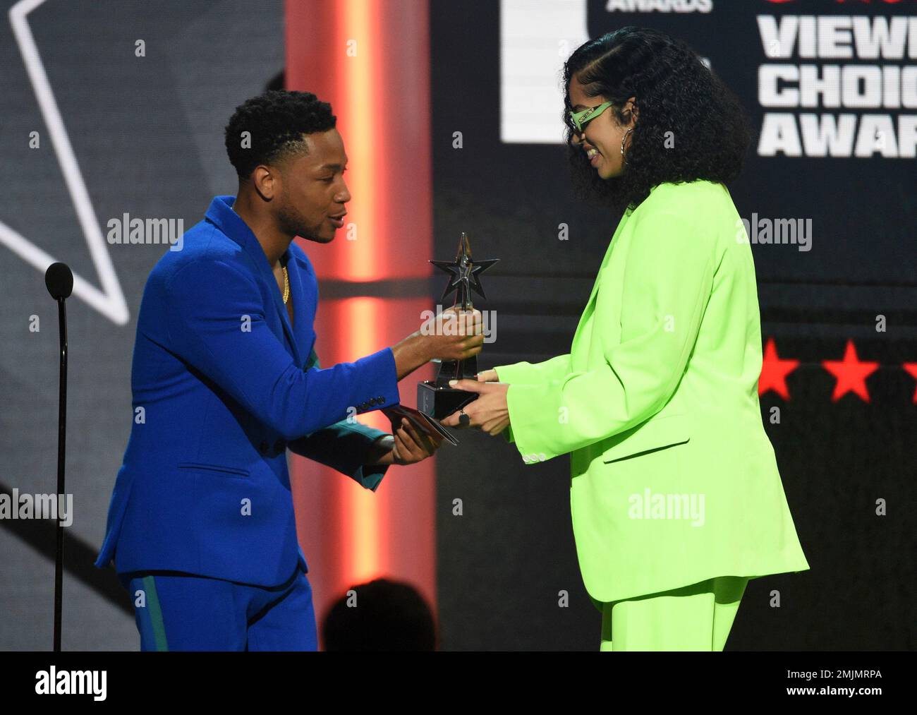 Jacob Latimore, left, presents Ella Mai with the viewers' choice award ...