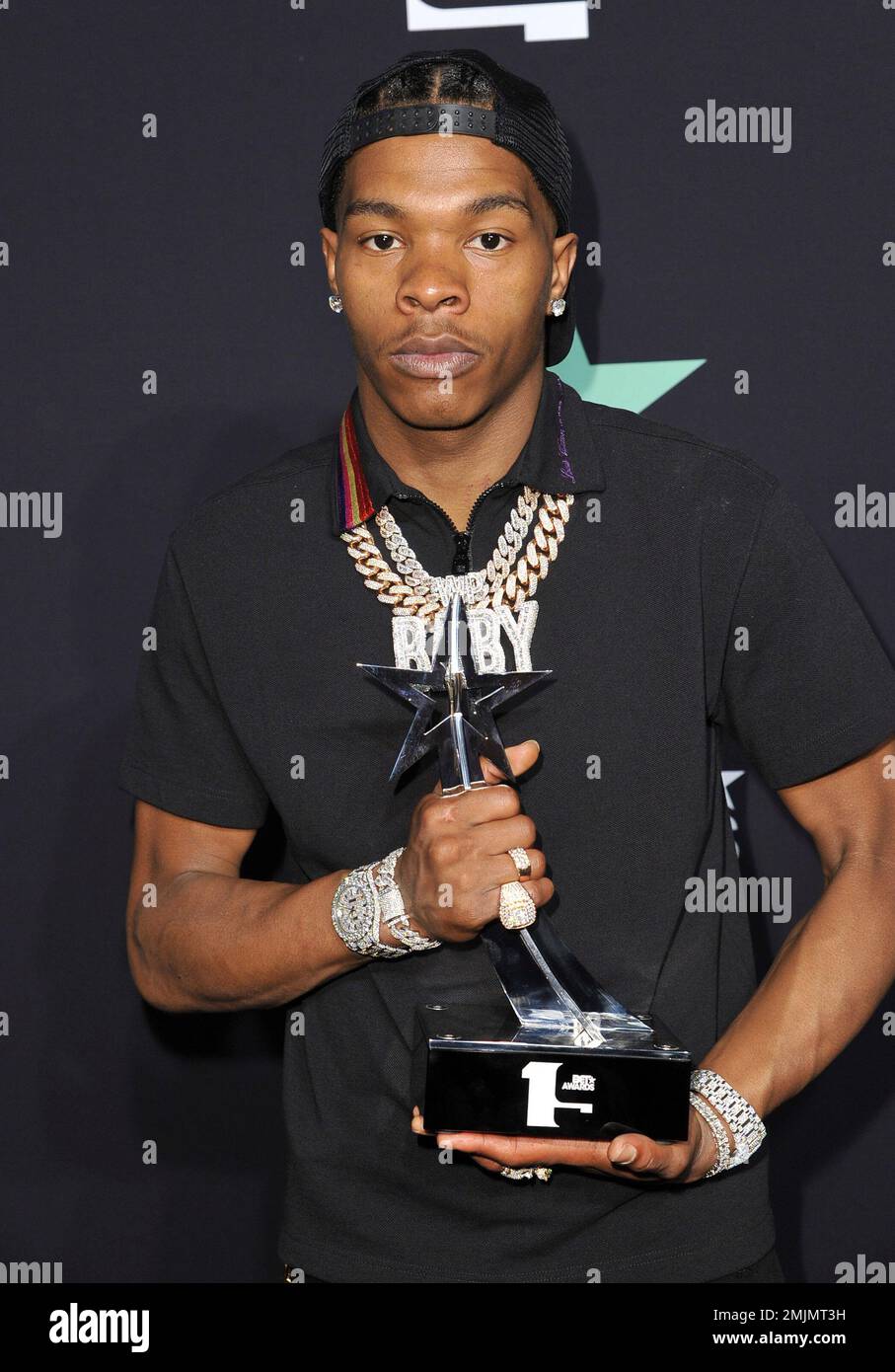 Lil Baby poses in the press room with the award for best new artist at ...