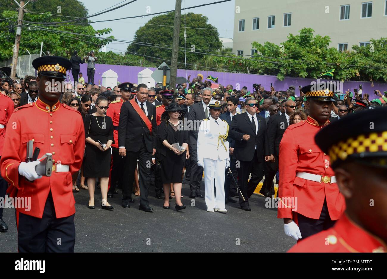 Prime Minister of Jamaica Andrew Holness, center wearing a red sash, is ...