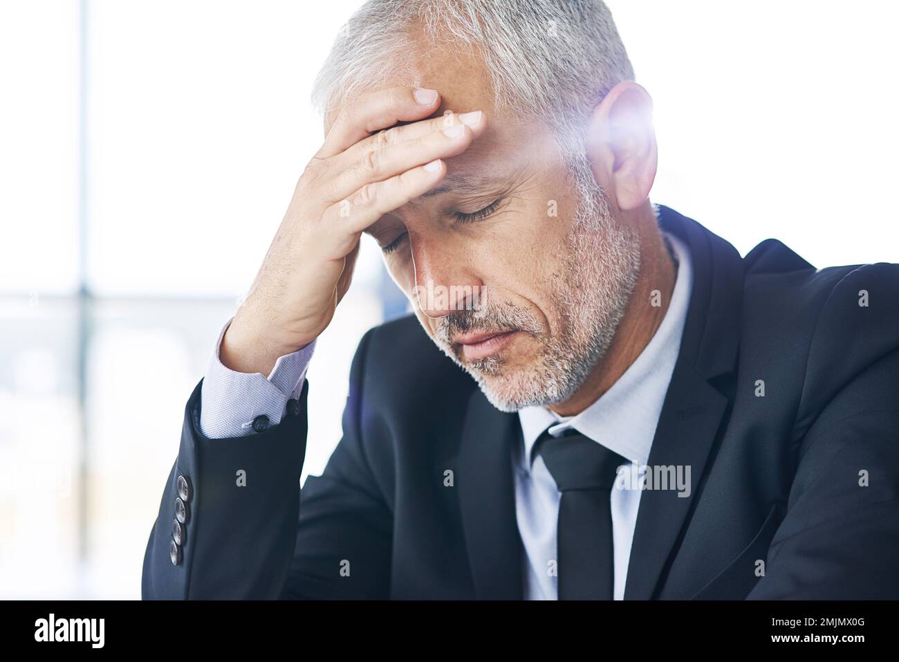 Hes facing a tough challenge. a mature businessman looking stressed out ...