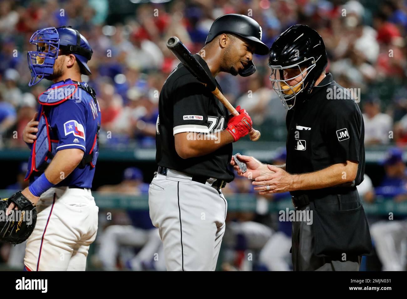 Texas Rangers catcher Jeff Mathis stands by the plate as Chicago White ...