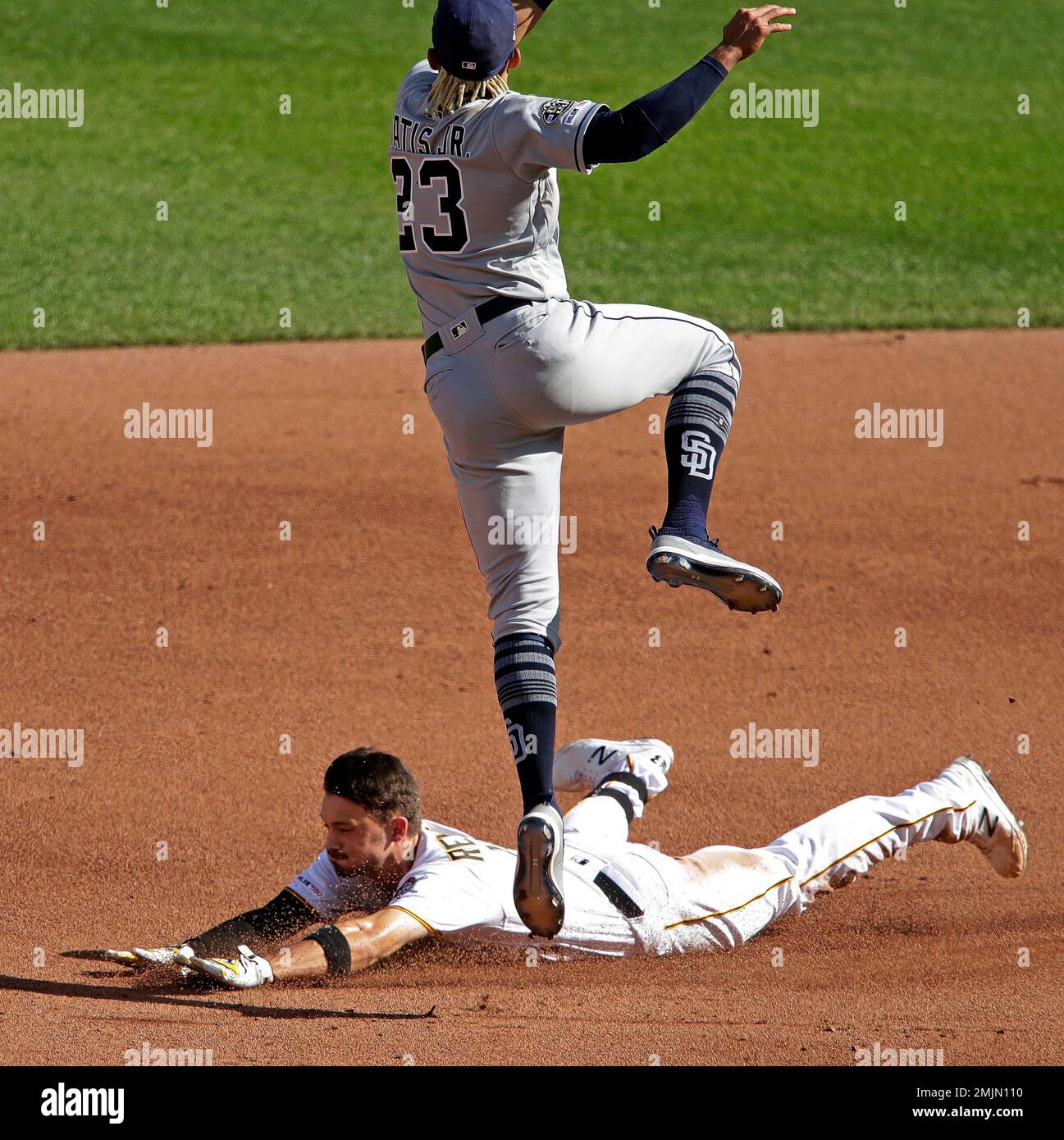 Pittsburgh Pirates' Bryan Reynolds, bottom, slides into second with a ...