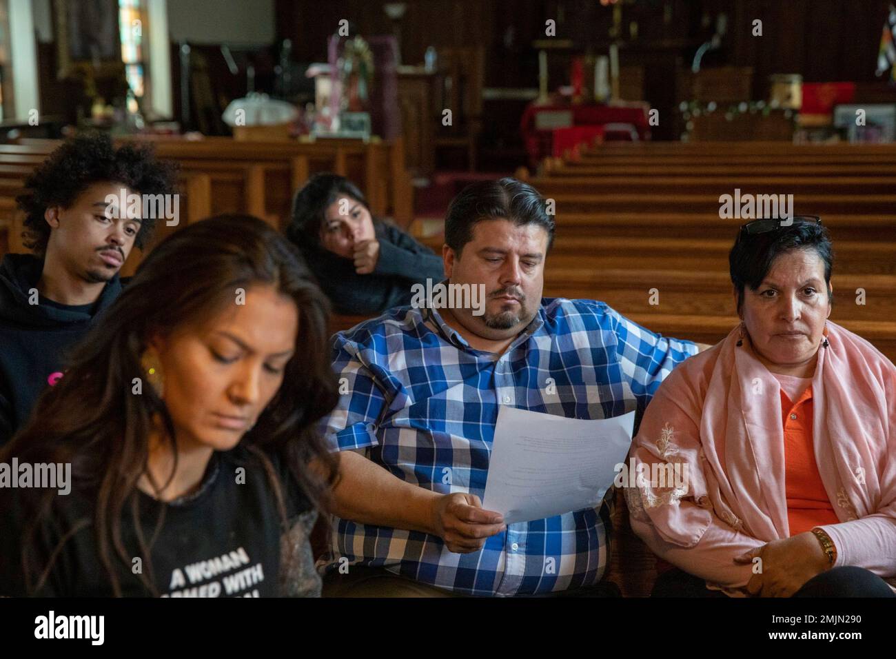 In this Wednesday, June 19, 2019 photo, attorney Roberto Lopez, center, of the Law Office of ...