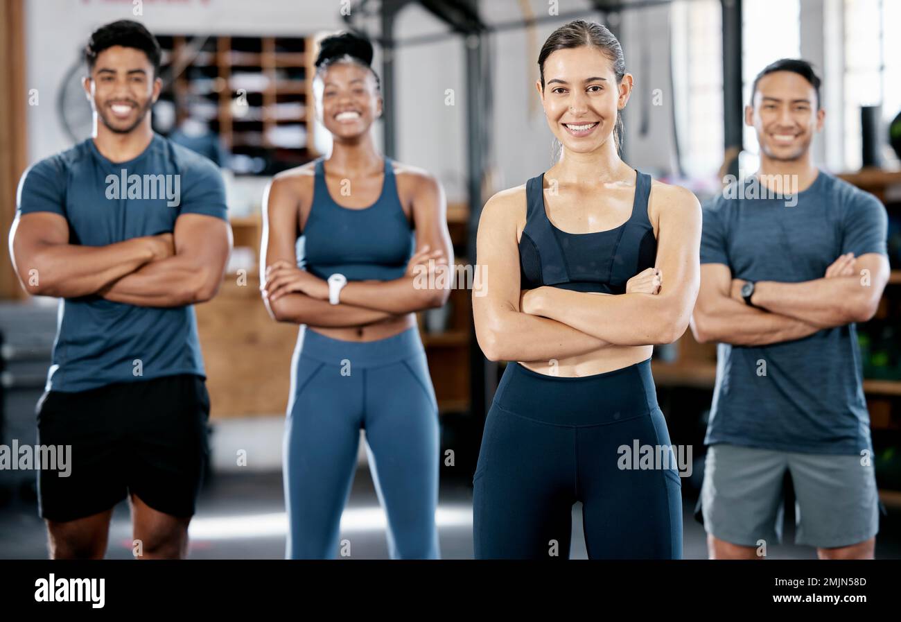 Fitness, portrait and woman coach with clients standing with crossed ...