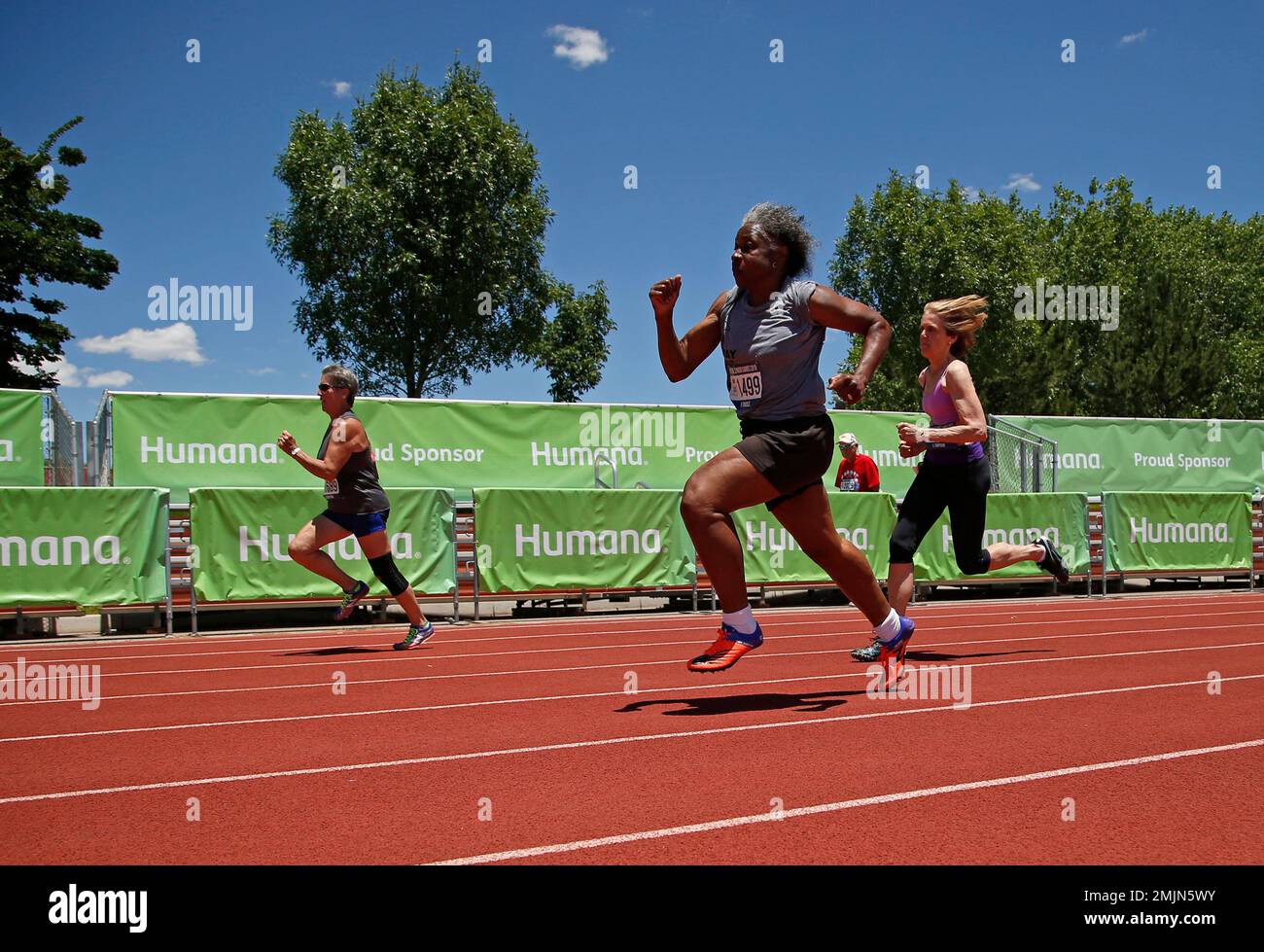 Senior Track and Field athletes during a neck and neck race at the 2019 ...