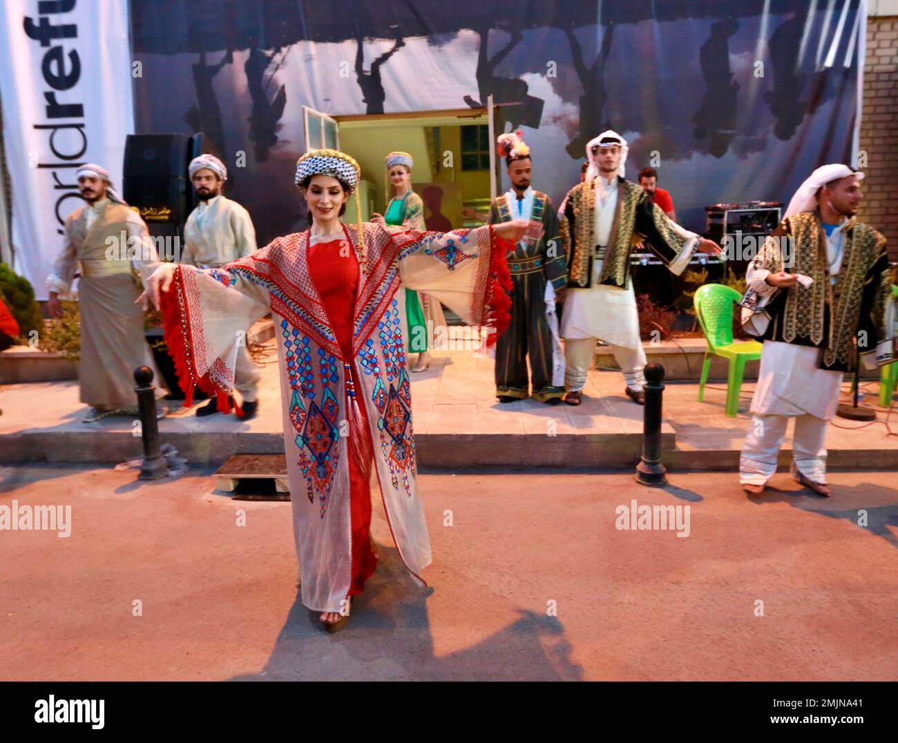 Dancers wearing traditional Iraqi folk costume perform during World ...
