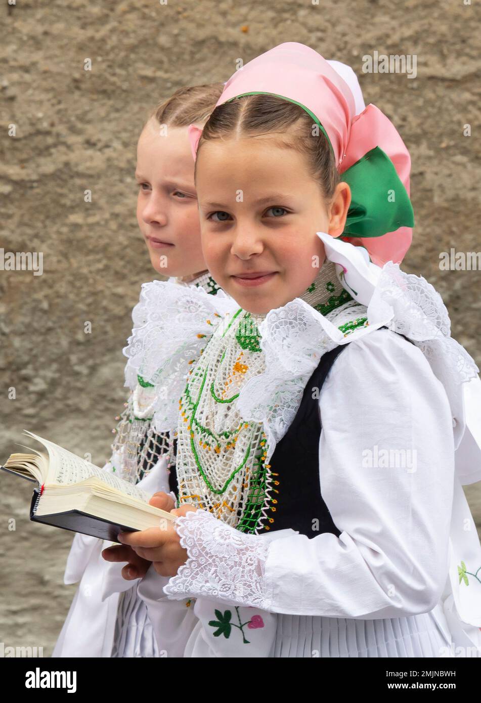 Children dressed in the traditional clothes of the Sorbs attend a ...