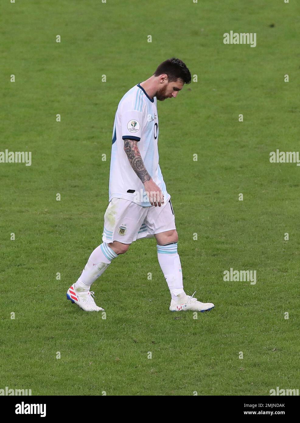 Argentina's Lionel Messi walks out of the pitch at the half time during ...