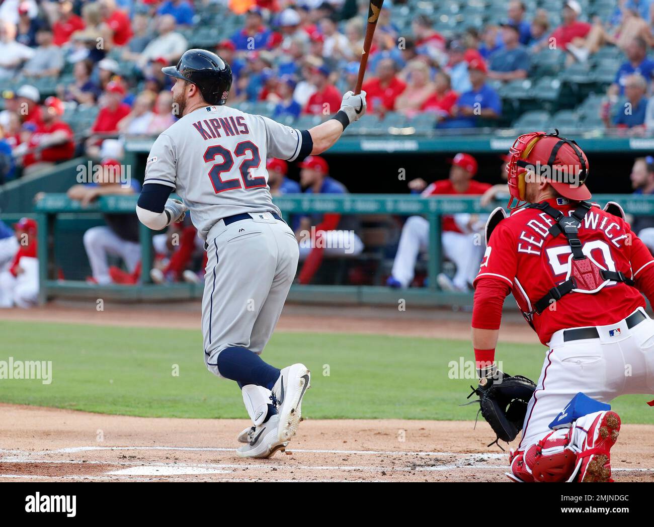 Cleveland Indians' Jason Kipnis (22) follows through on a three-run ...