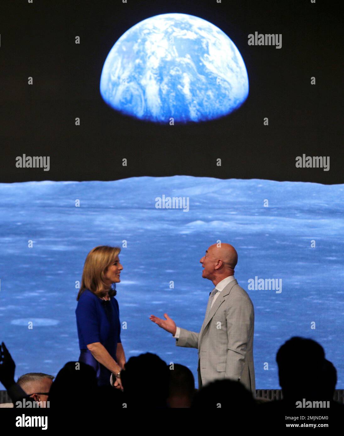 Amazon and Blue Origin founder Jeff Bezos, right, talks with Caroline Kennedy during the JFK ...