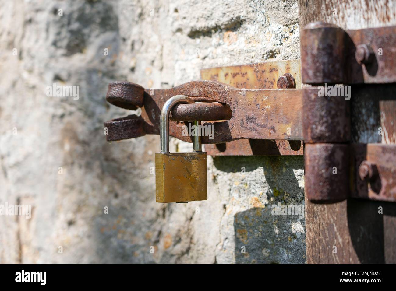 Padlock on an old rusted metal latch Stock Photo - Alamy
