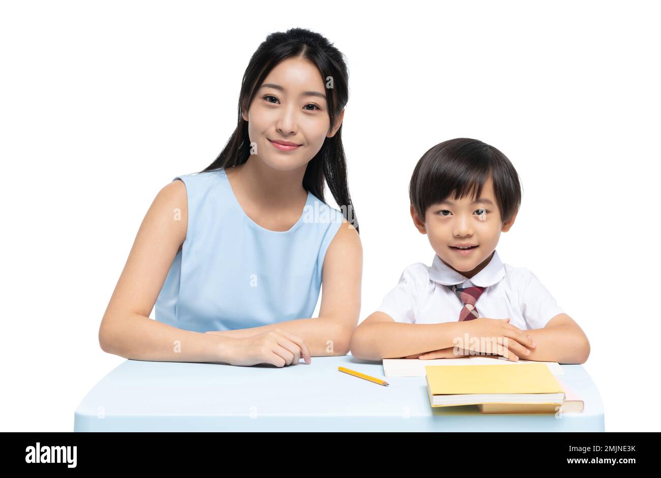 A young female teacher counseling boy learning Stock Photo - Alamy