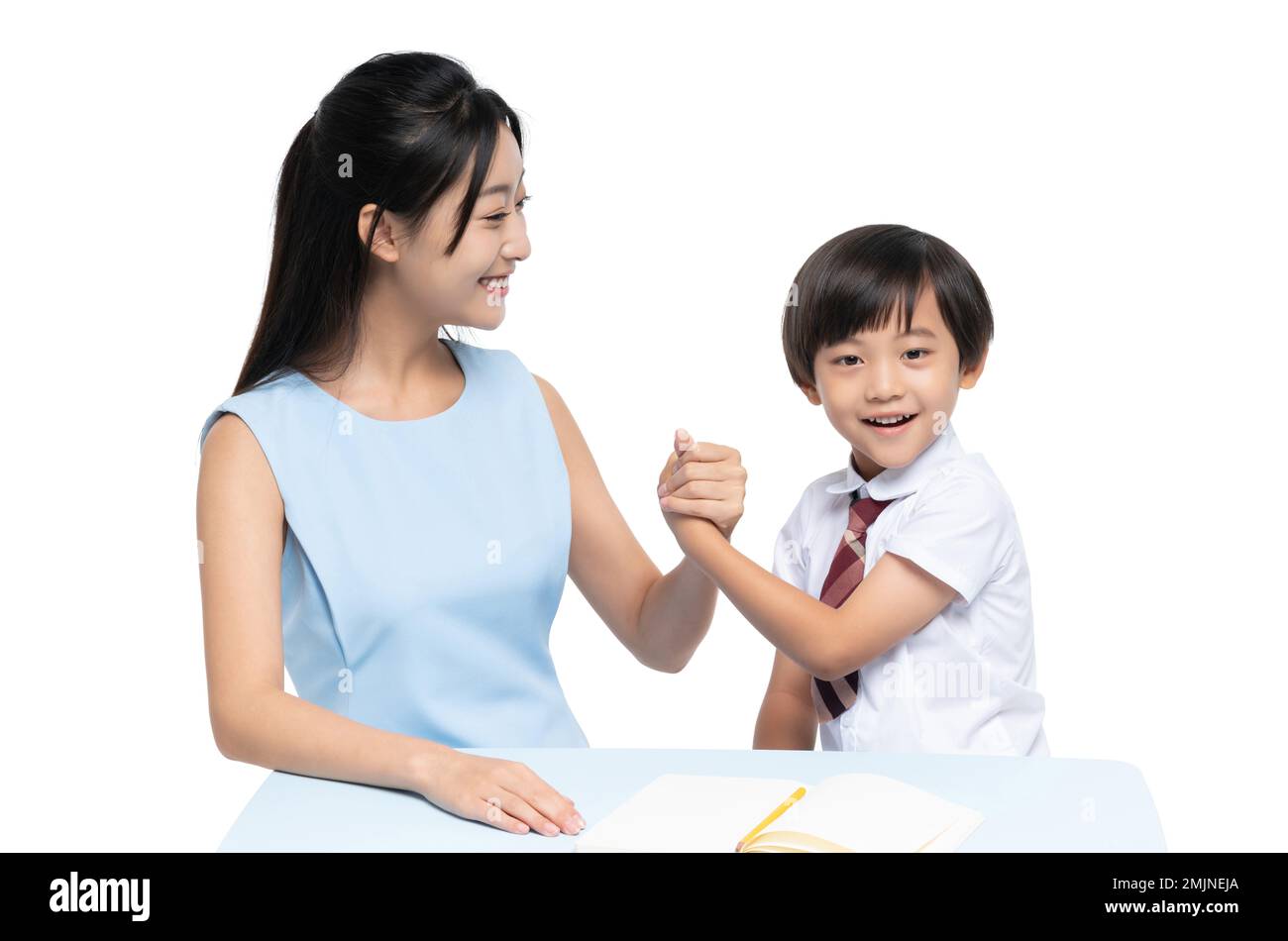 A young female teacher counseling boy learning Stock Photo - Alamy