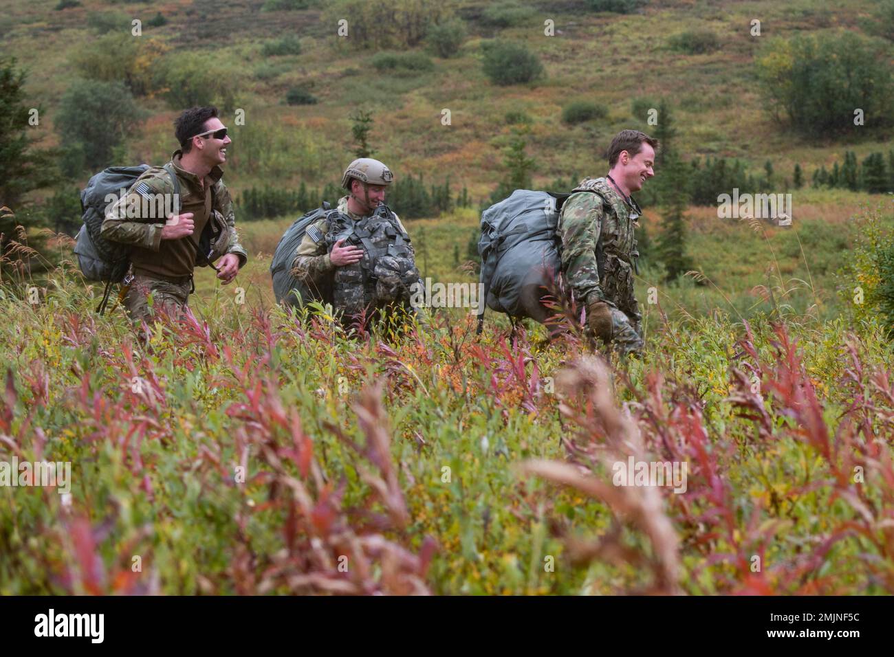 Airmen make their way to the rally point after airborne operations at ...