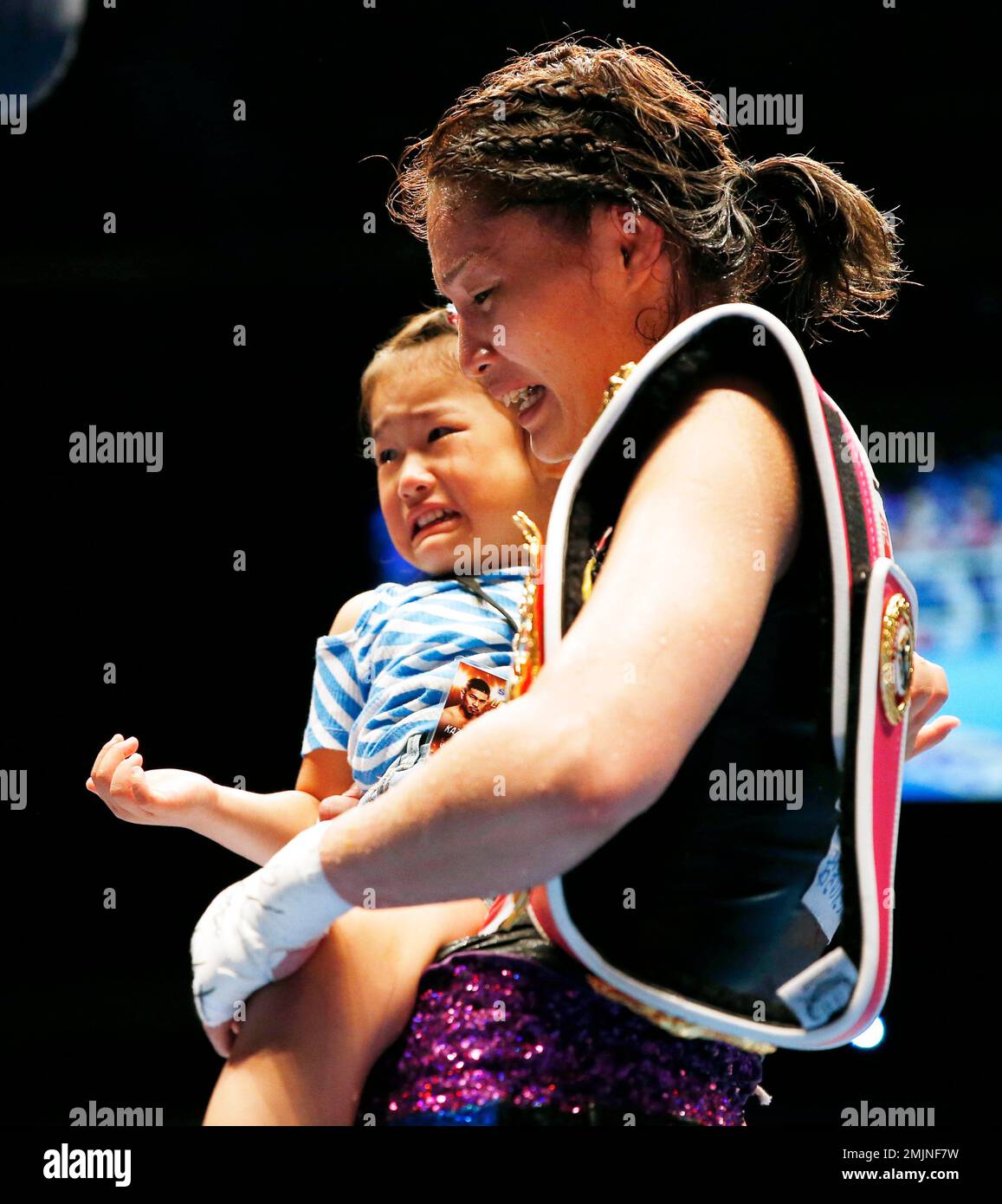 Japan's Miyo Yoshida cries while holding her daughter Miina after ...