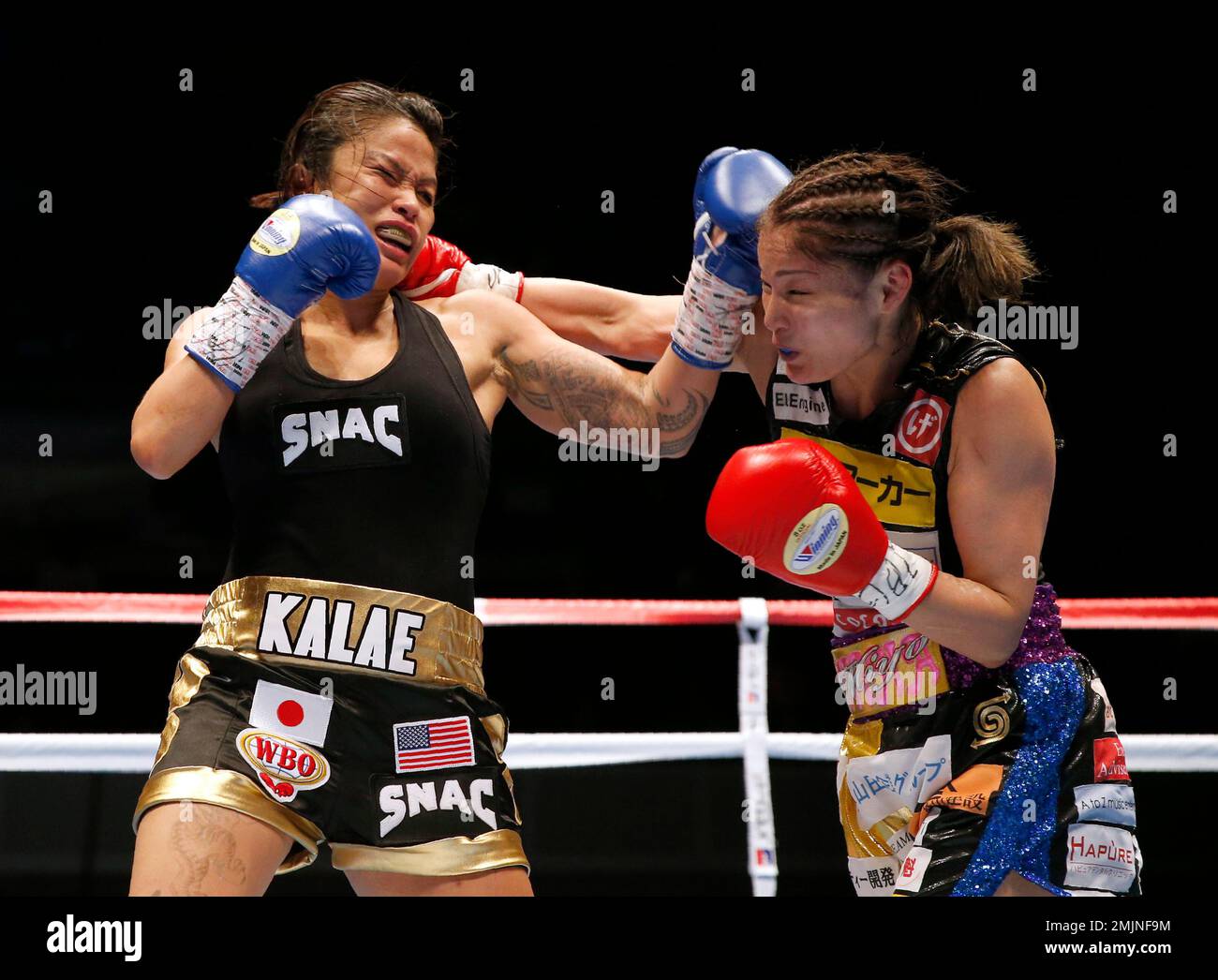 Japan's Miyo Yoshida, right, sends a right to Casey Morton of the U.S ...